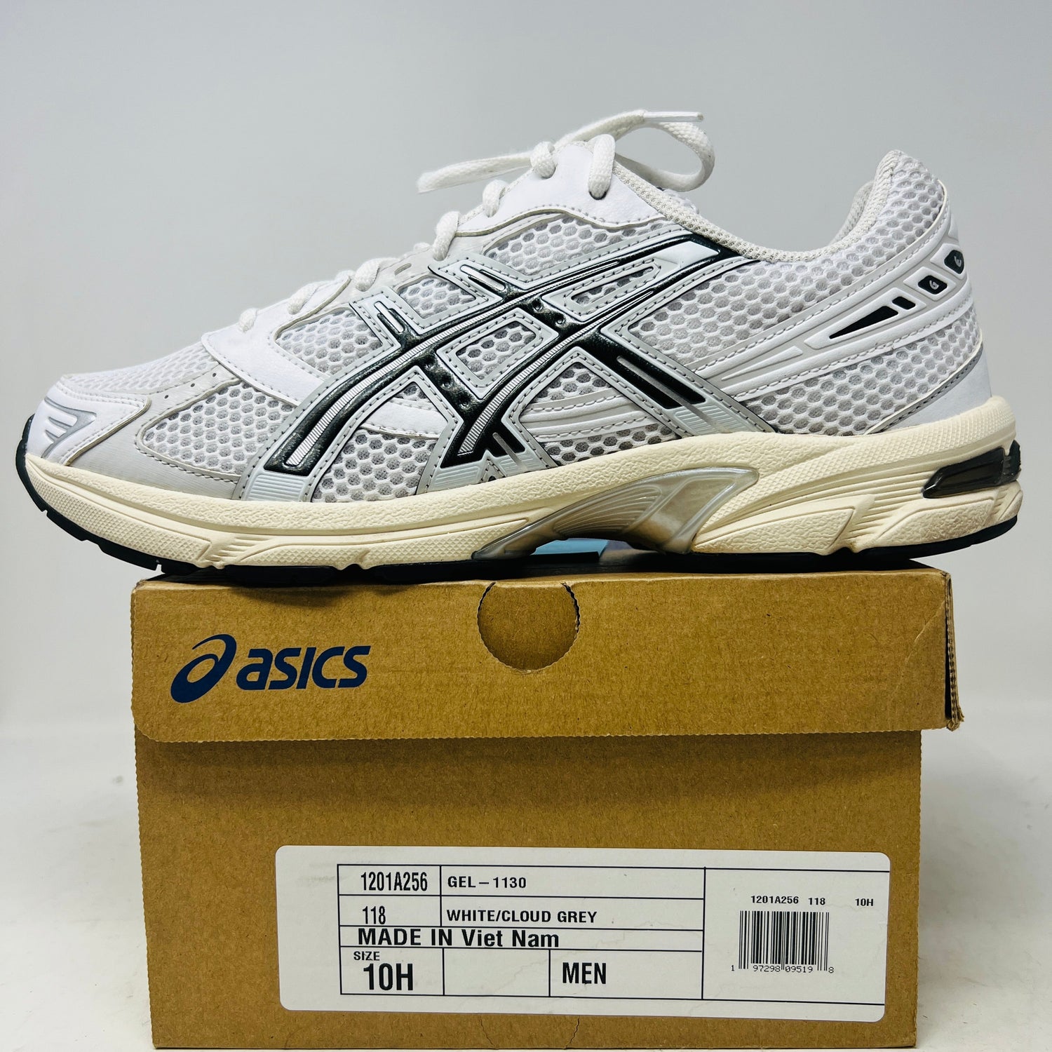 A pristine pair of ASICS Gel-1130 White Cloud Grey sneakers with black ...